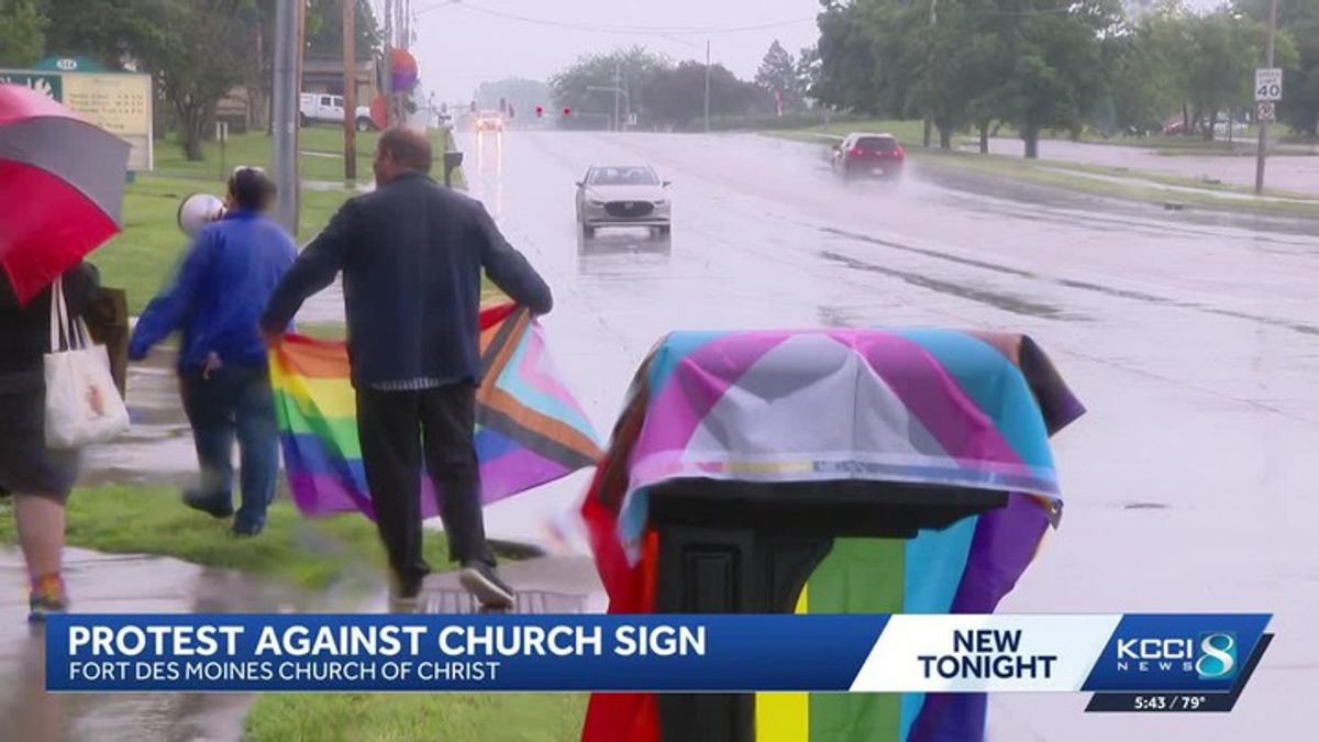 Activists protest church sign in Des Moines during Pride Month ...