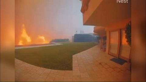 Ring camera footage showed flames close to her home. Then, firefighters ...