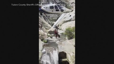 Video shows dramatic rescue of a hiker stuck behind a waterfall in ...